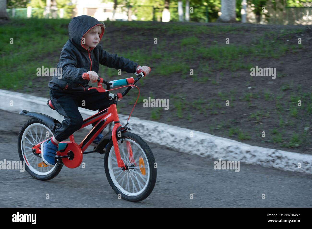 Spring bike ride. boy learning to ride a bicycle. Child rides Bicycle ...