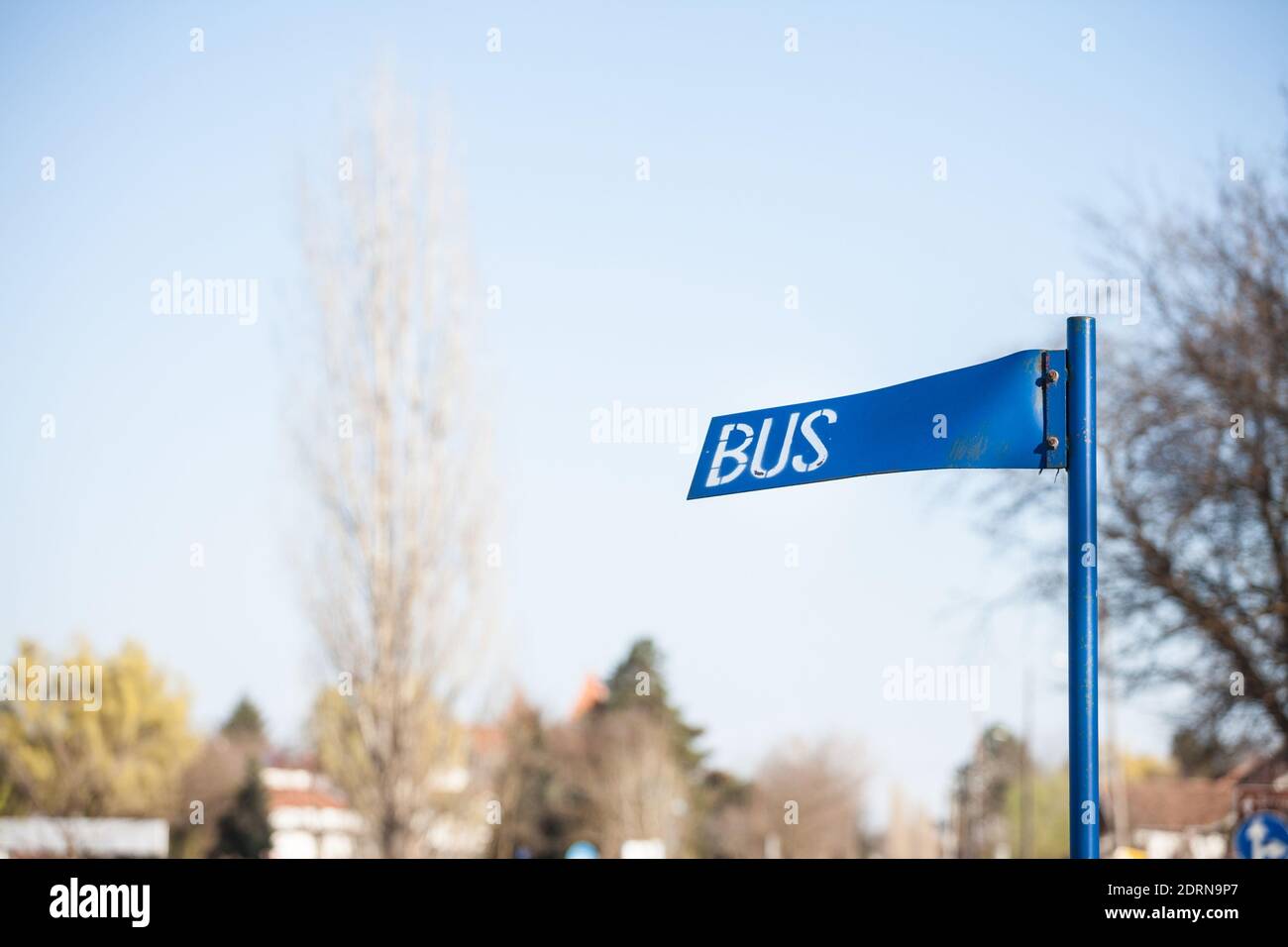 Old bus stop in Subotica, Serbia, with a damage blue sign with the name ...