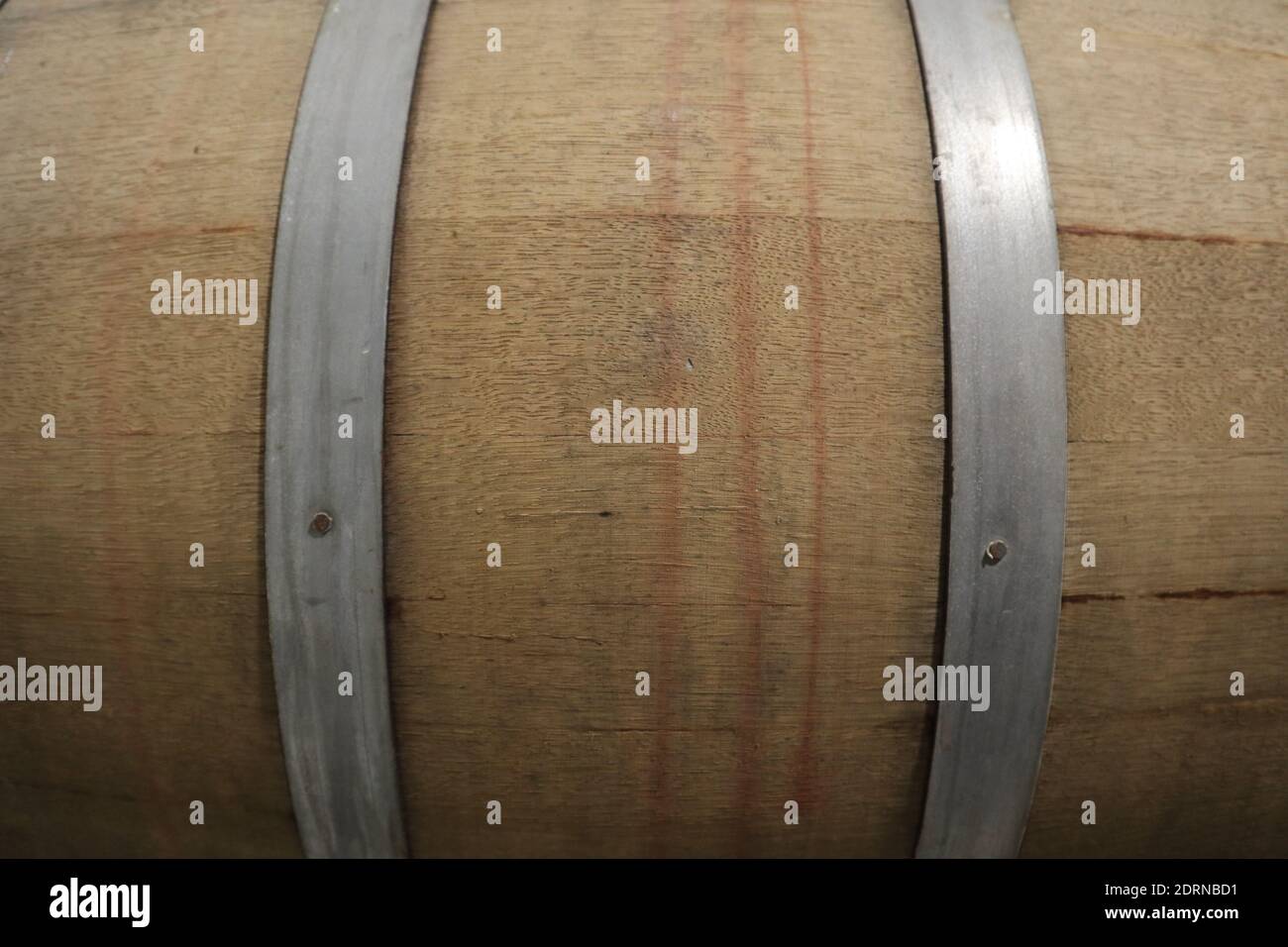 A close up of oak wood wine barrel with metal bands Stock Photo - Alamy