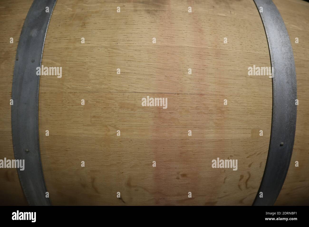 A close up of oak wood wine barrel with metal bands Stock Photo - Alamy