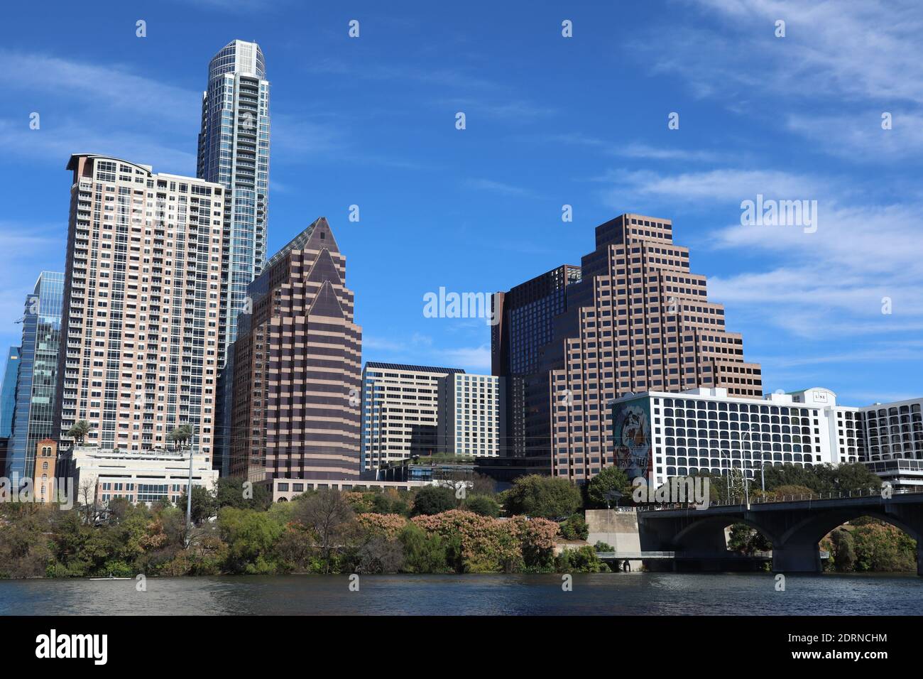 A vertical shot of across the Colorado River to the skyline of downtown ...