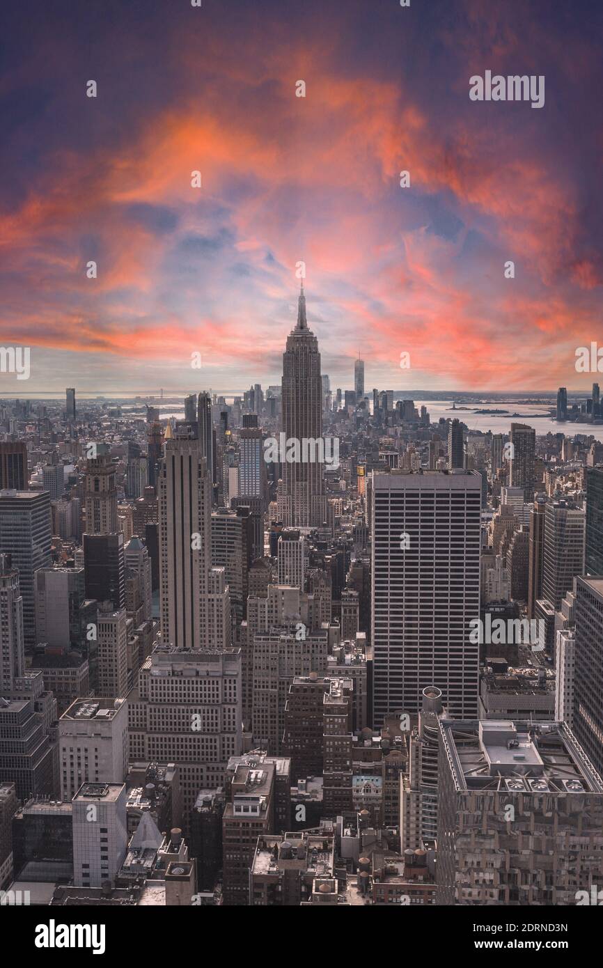 A beautiful sunset over New York City, United States featuring the Top ...