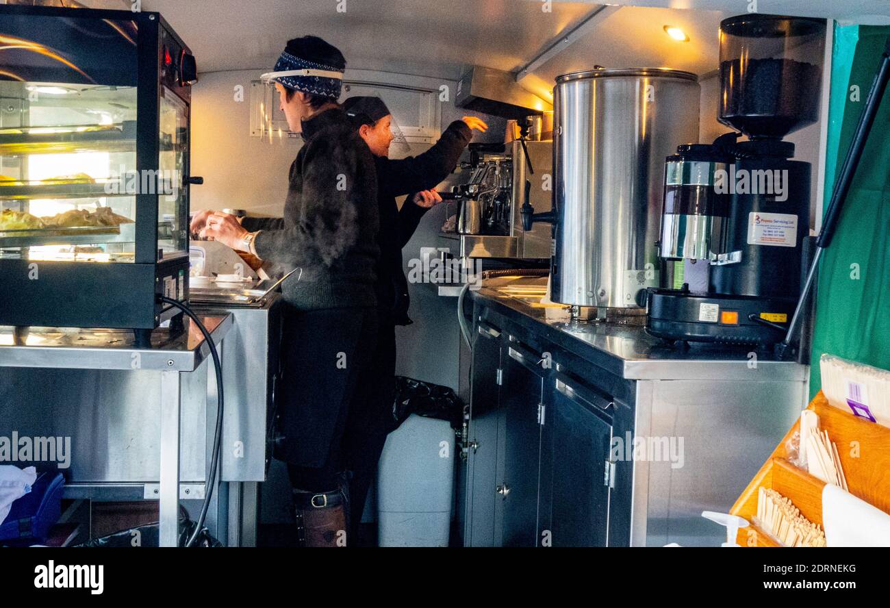 Hardworking staff in a coffee and snack take away van Stock Photo - Alamy