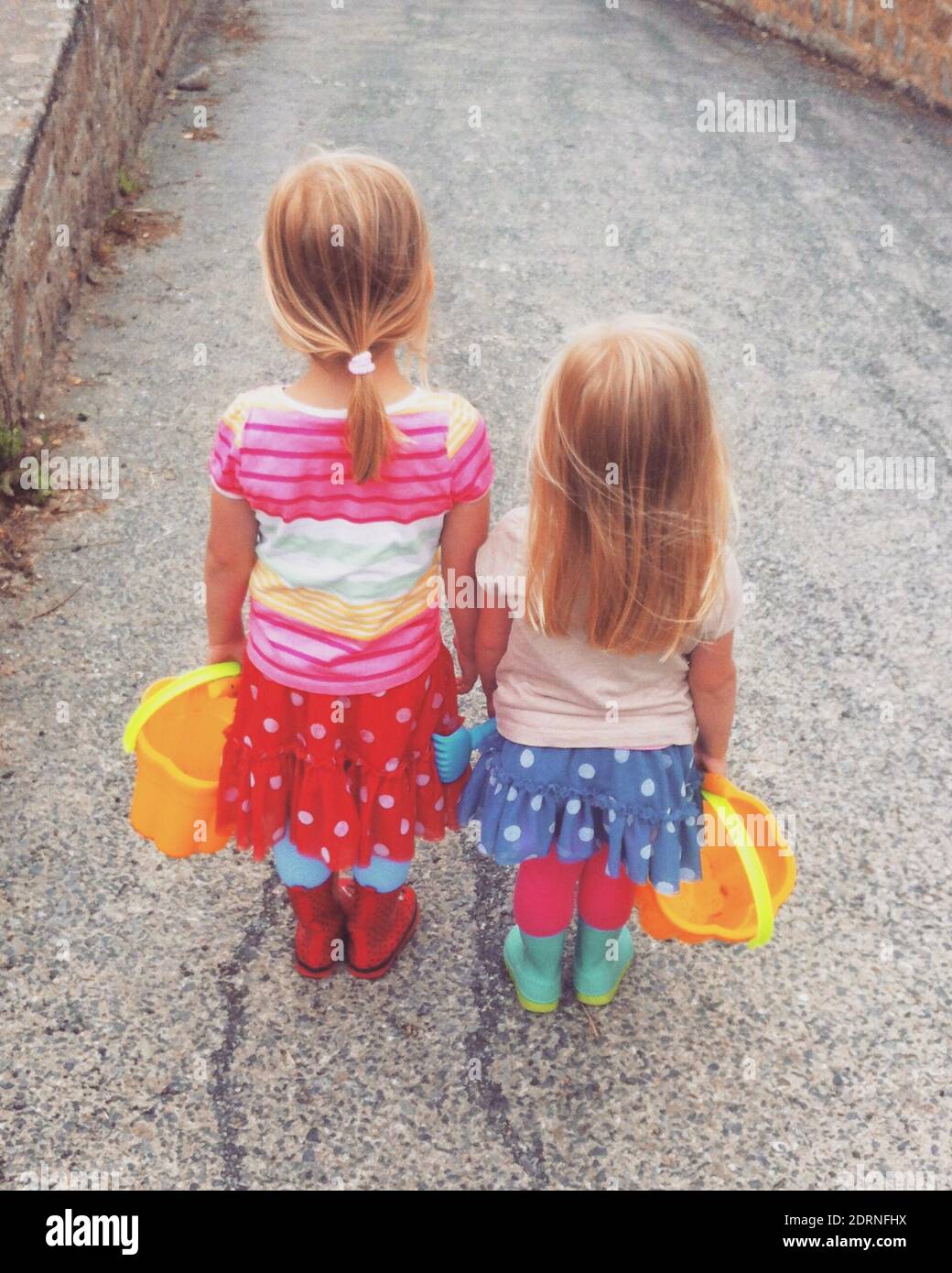 Girls Carrying Bucket High Resolution Stock Photography and Images - Alamy