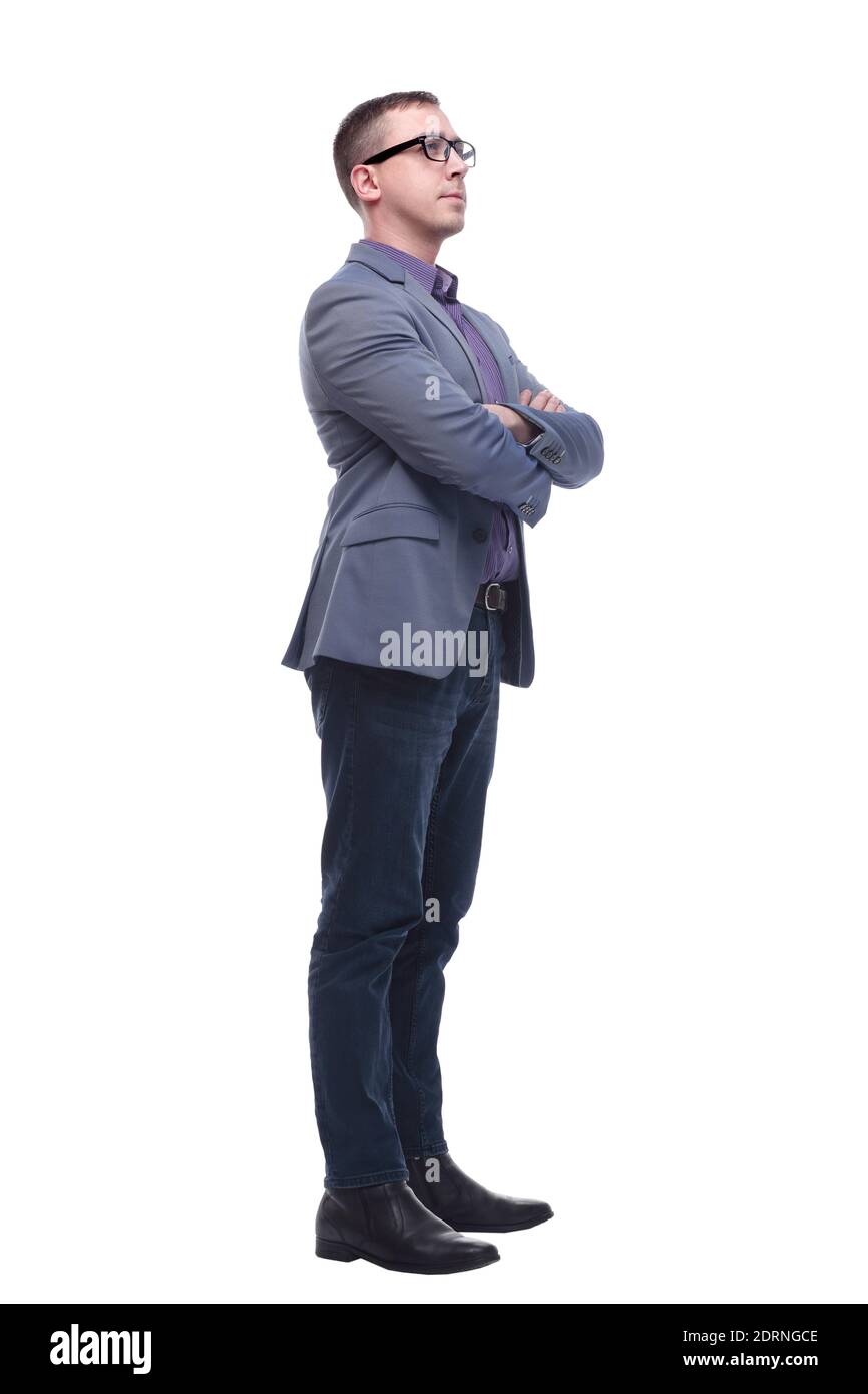 Side view of confident businessman with arms folded against white ...