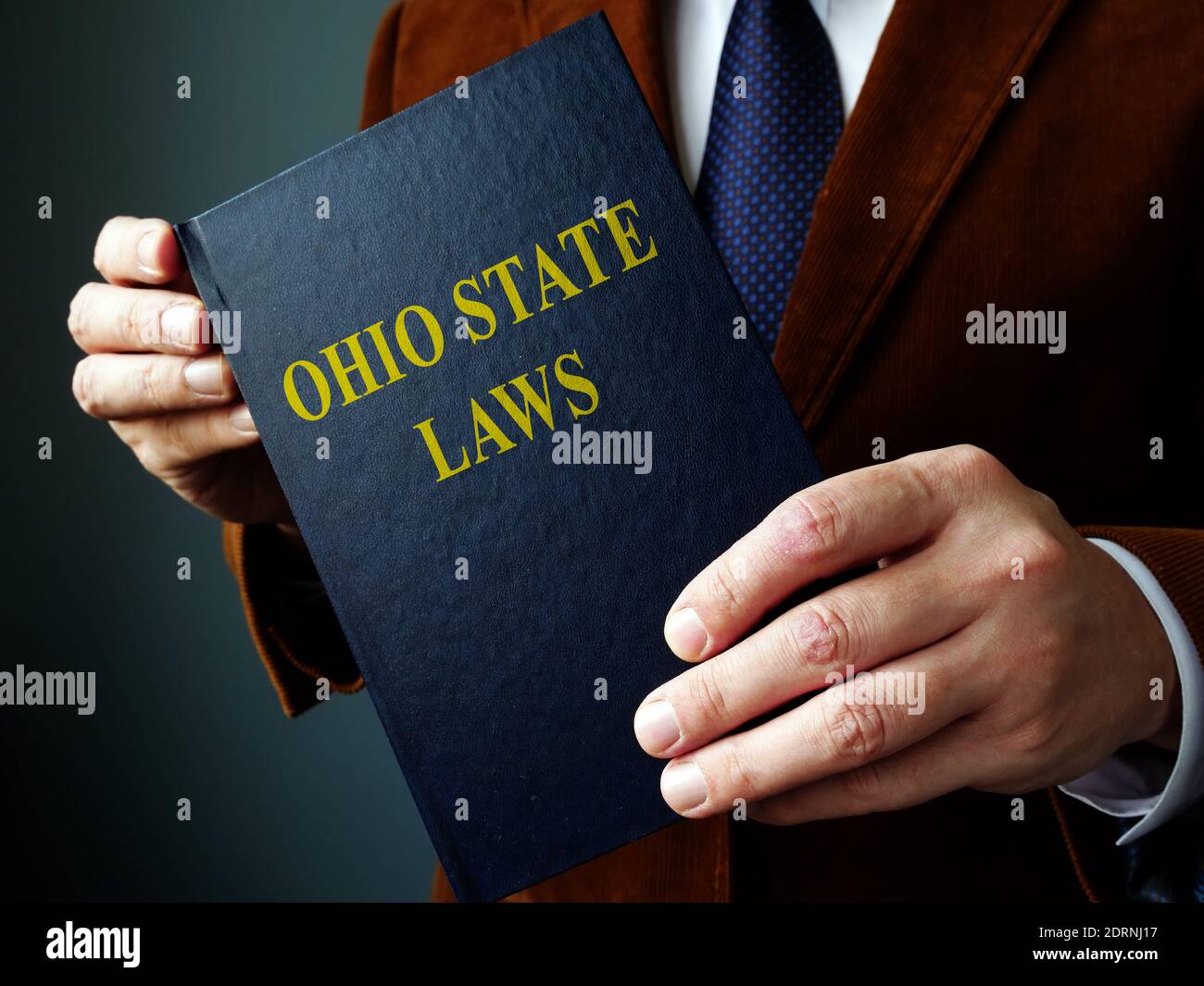 Ohio state law concept. The man is holding a book Stock Photo - Alamy