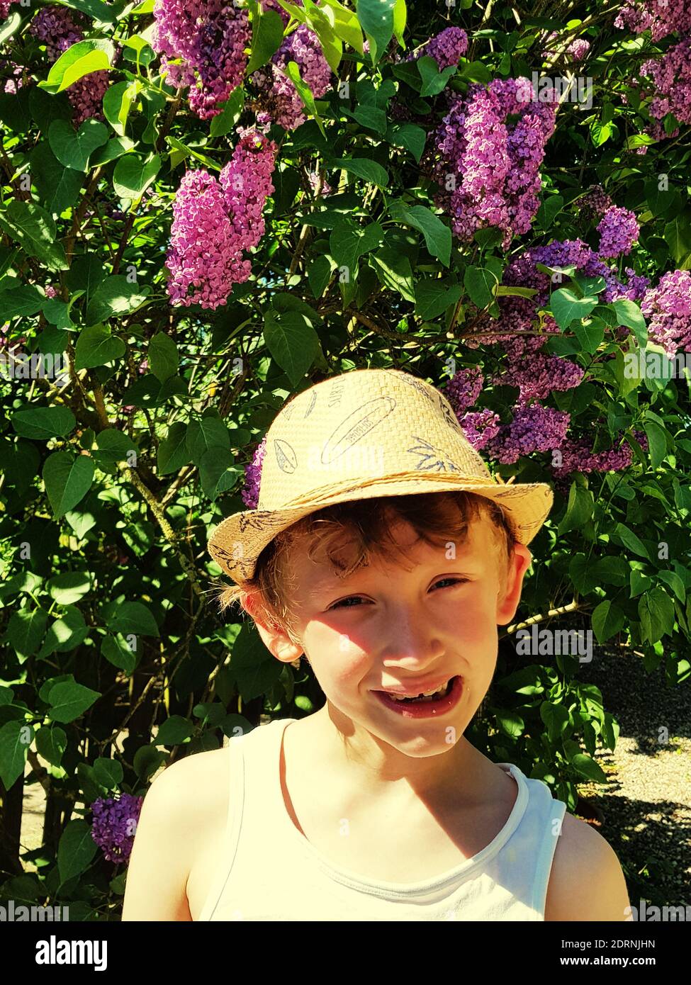 Boy wearing flower hat hi-res stock photography and images - Alamy
