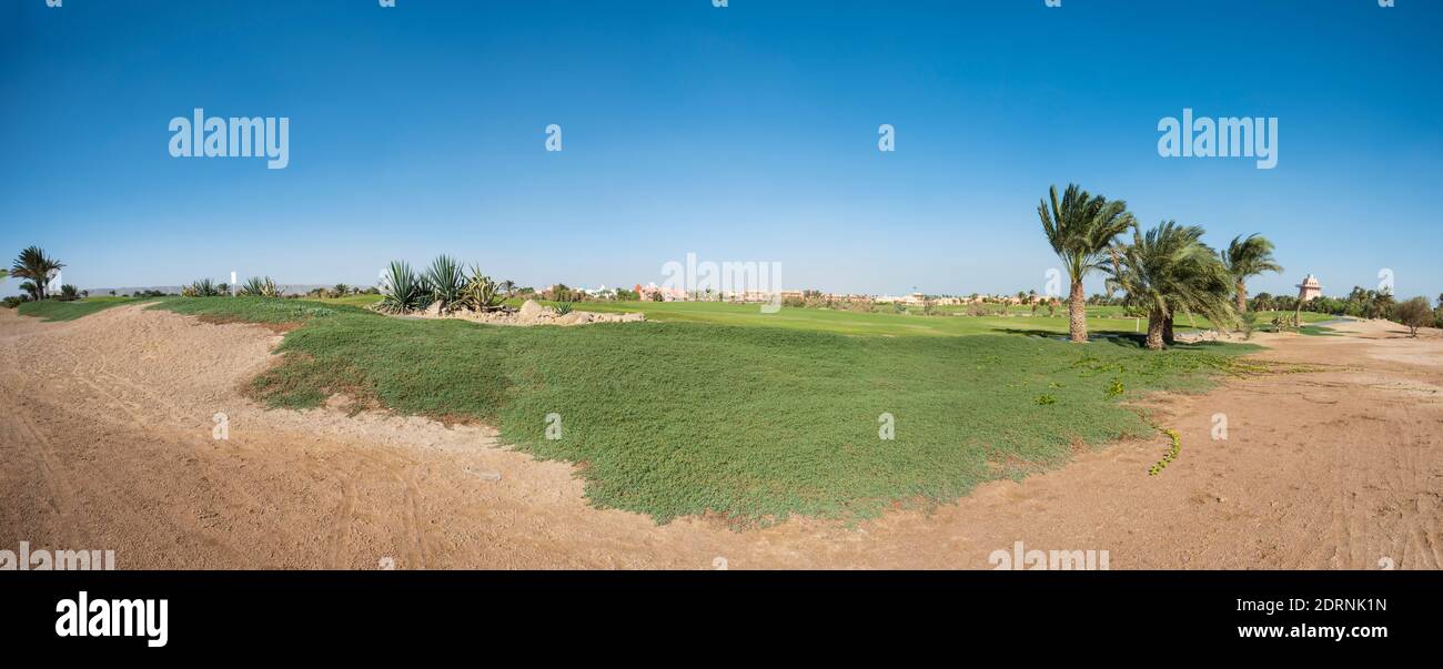 Panoramic view across golf course through beautiful landscaped gardens ...