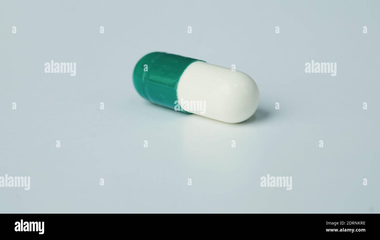 Close-up Of Pill Against White Background Stock Photo - Alamy
