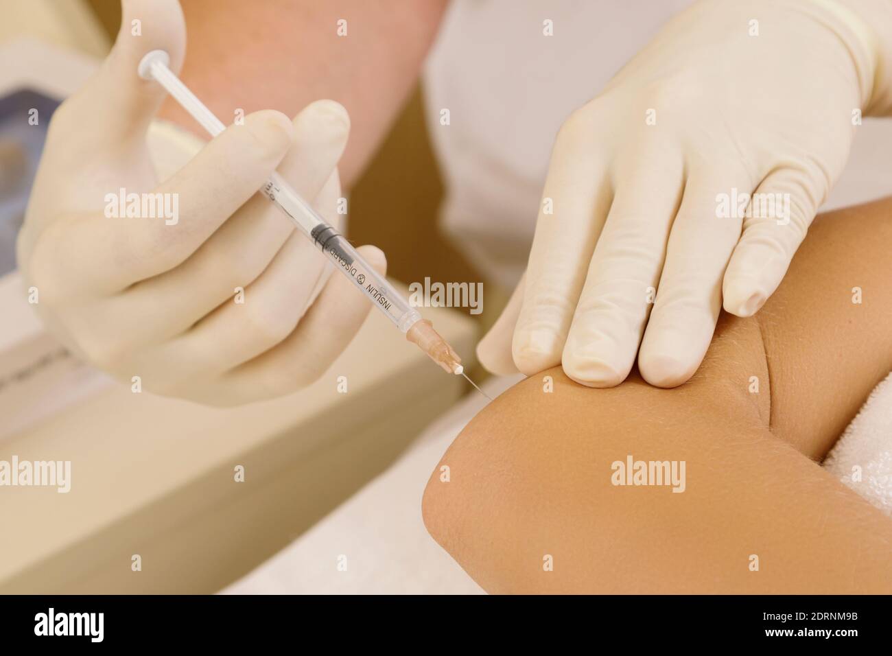 Woman got injection in elbow. Concept of skin rejuvenation or joint ...