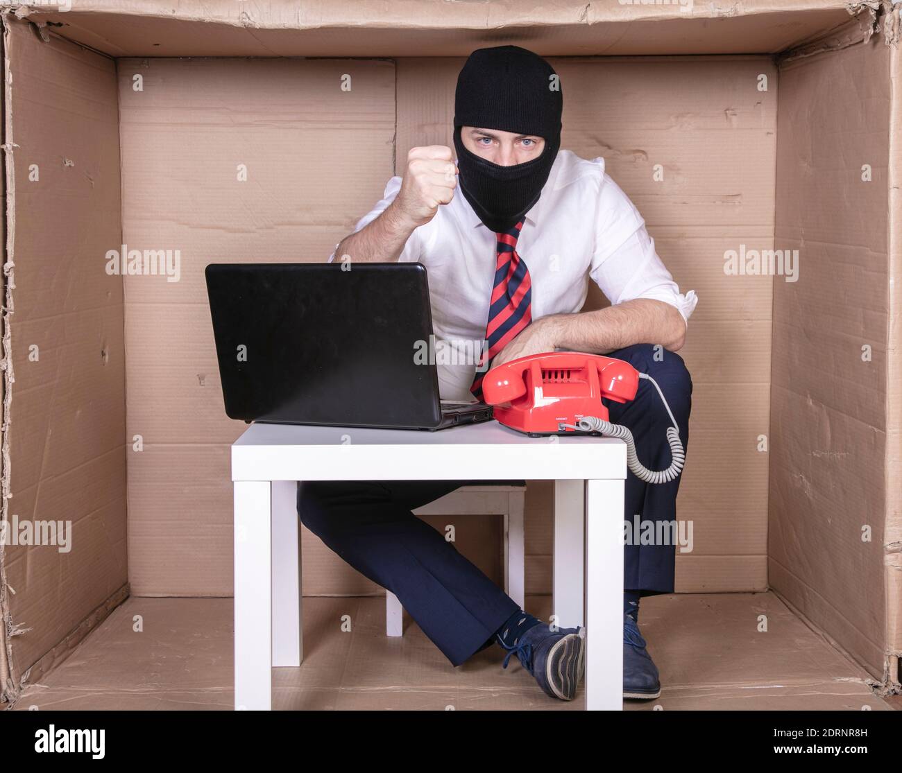 Undercover cop threatens fists, warning to the villains Stock Photo - Alamy