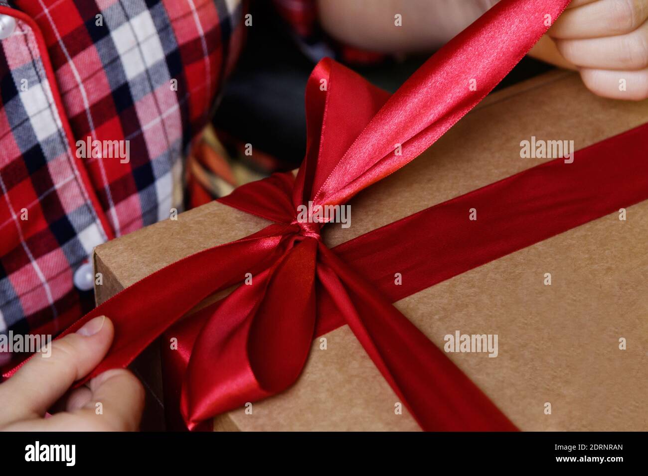 Unpacking of the Christmas gift Stock Photo - Alamy