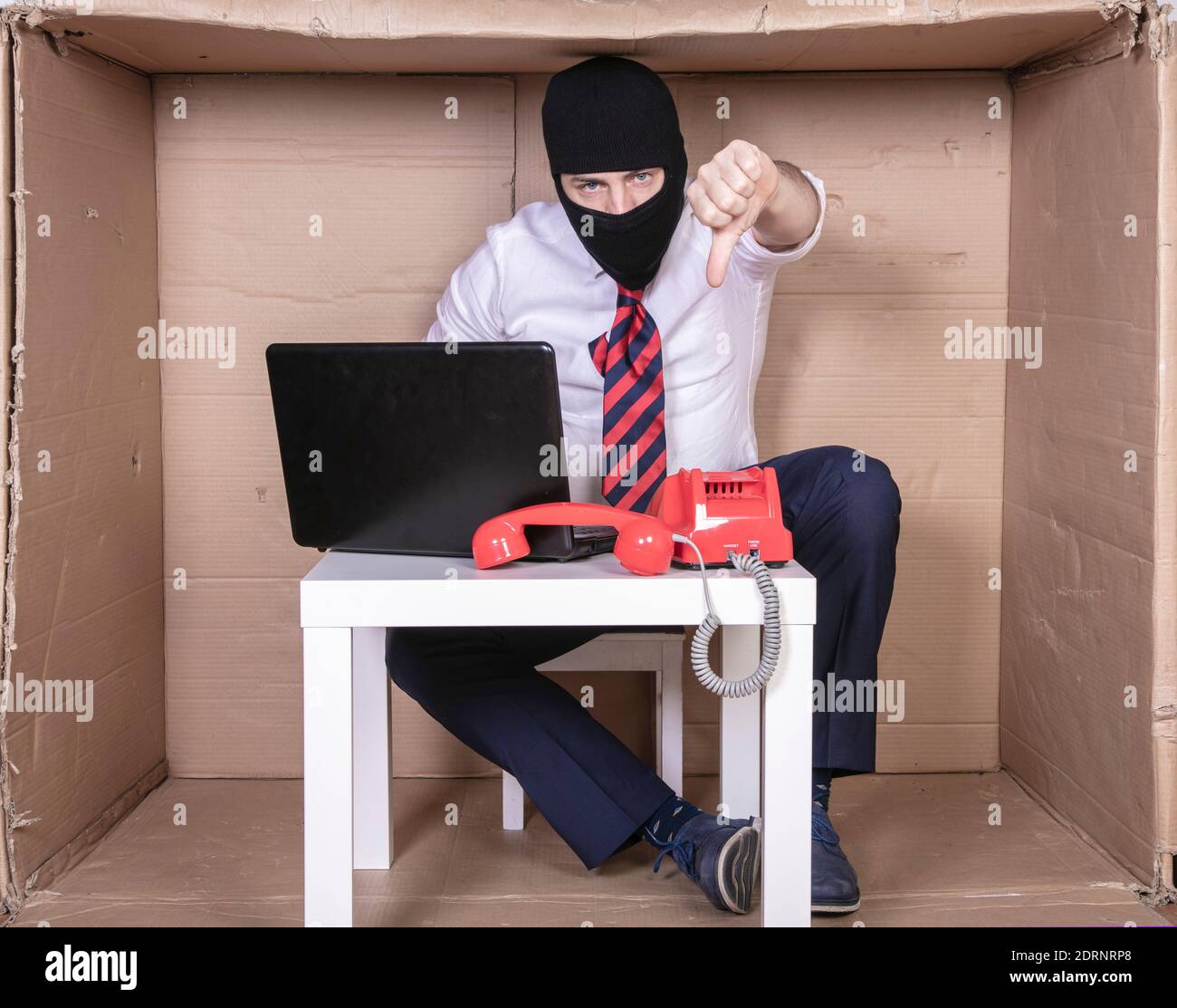 Secret employee fights cybercriminals, shows thumbs down Stock Photo ...
