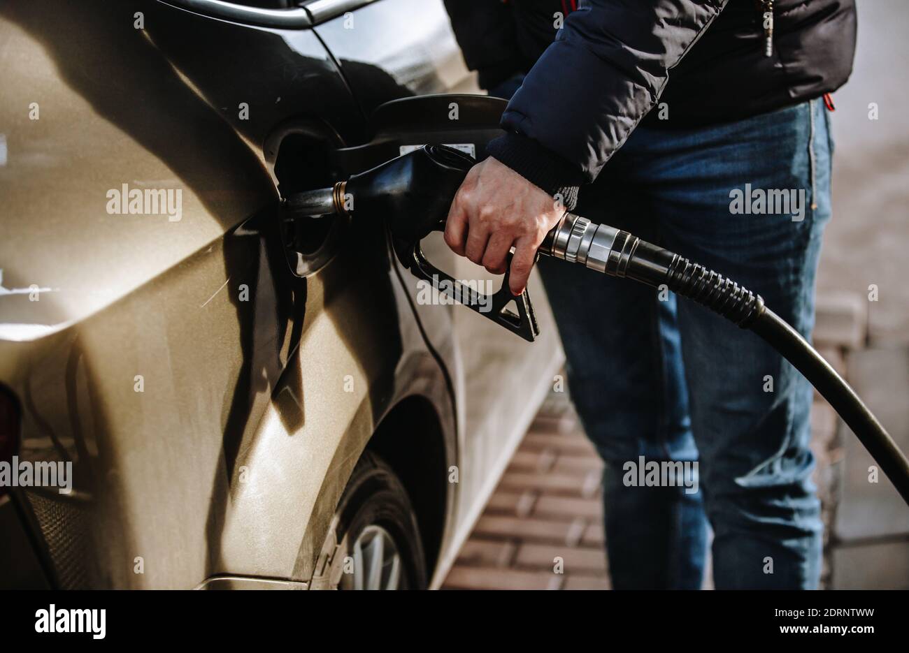 Man refueling a car in the gas station, refuel the car Stock Photo - Alamy