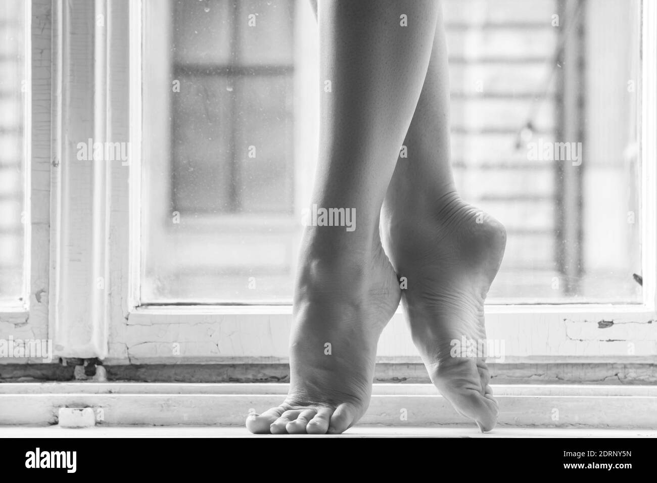 Feet on windowsill hi-res stock photography and images - Alamy