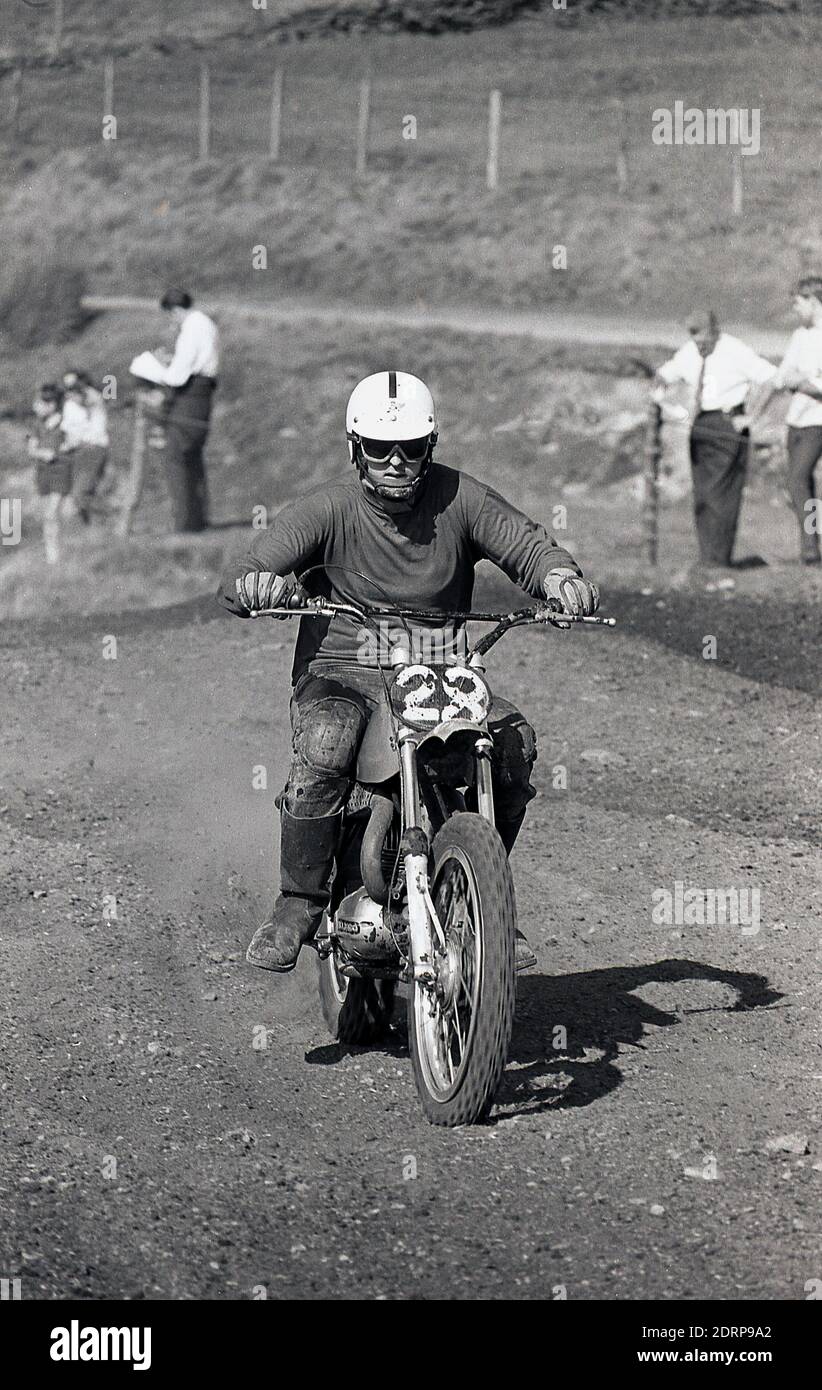 1970s, historical, motorcross event....a male rider competing in a ...