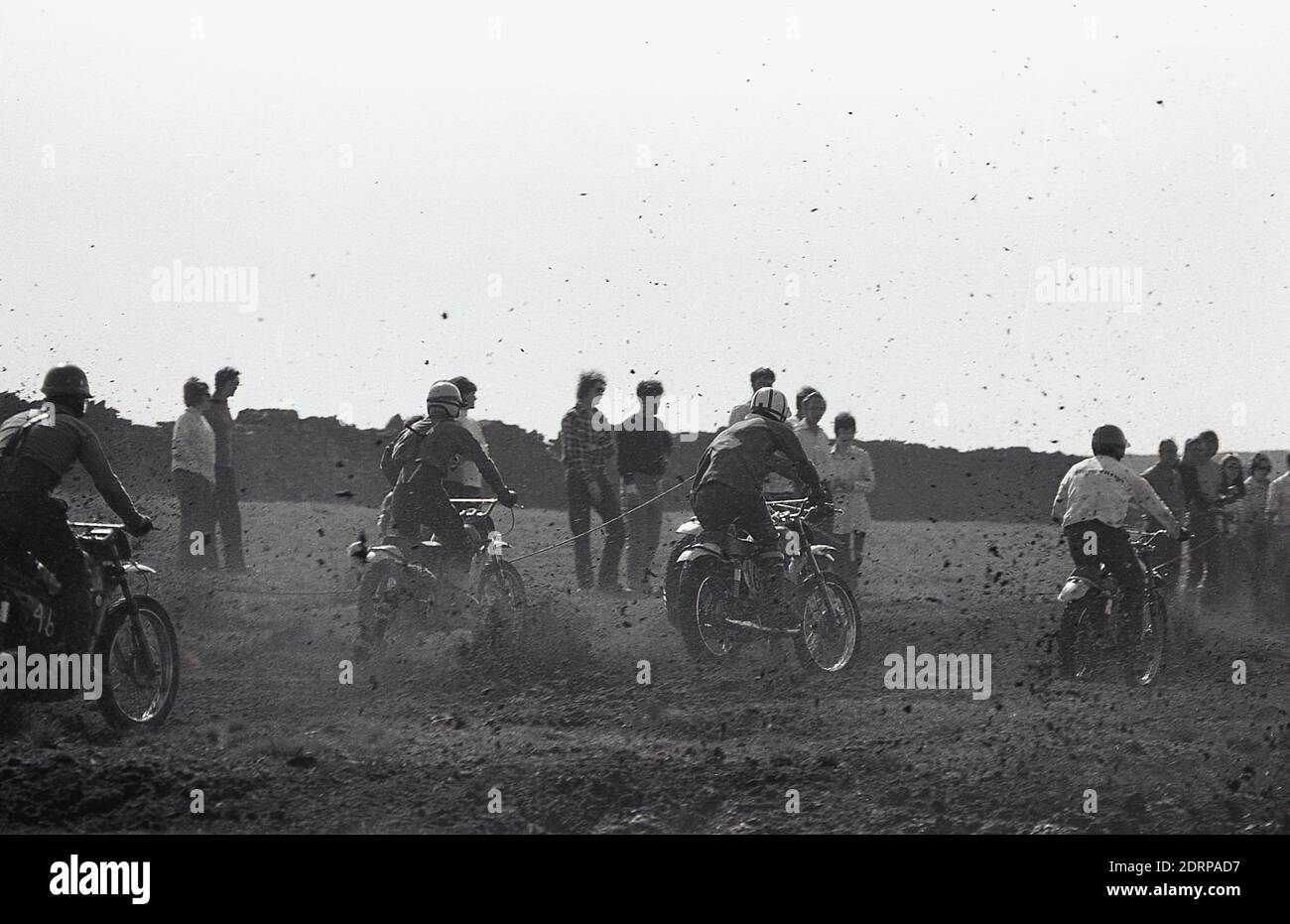 1970s, historical, dirt flies up as competitors take part in a motor ...