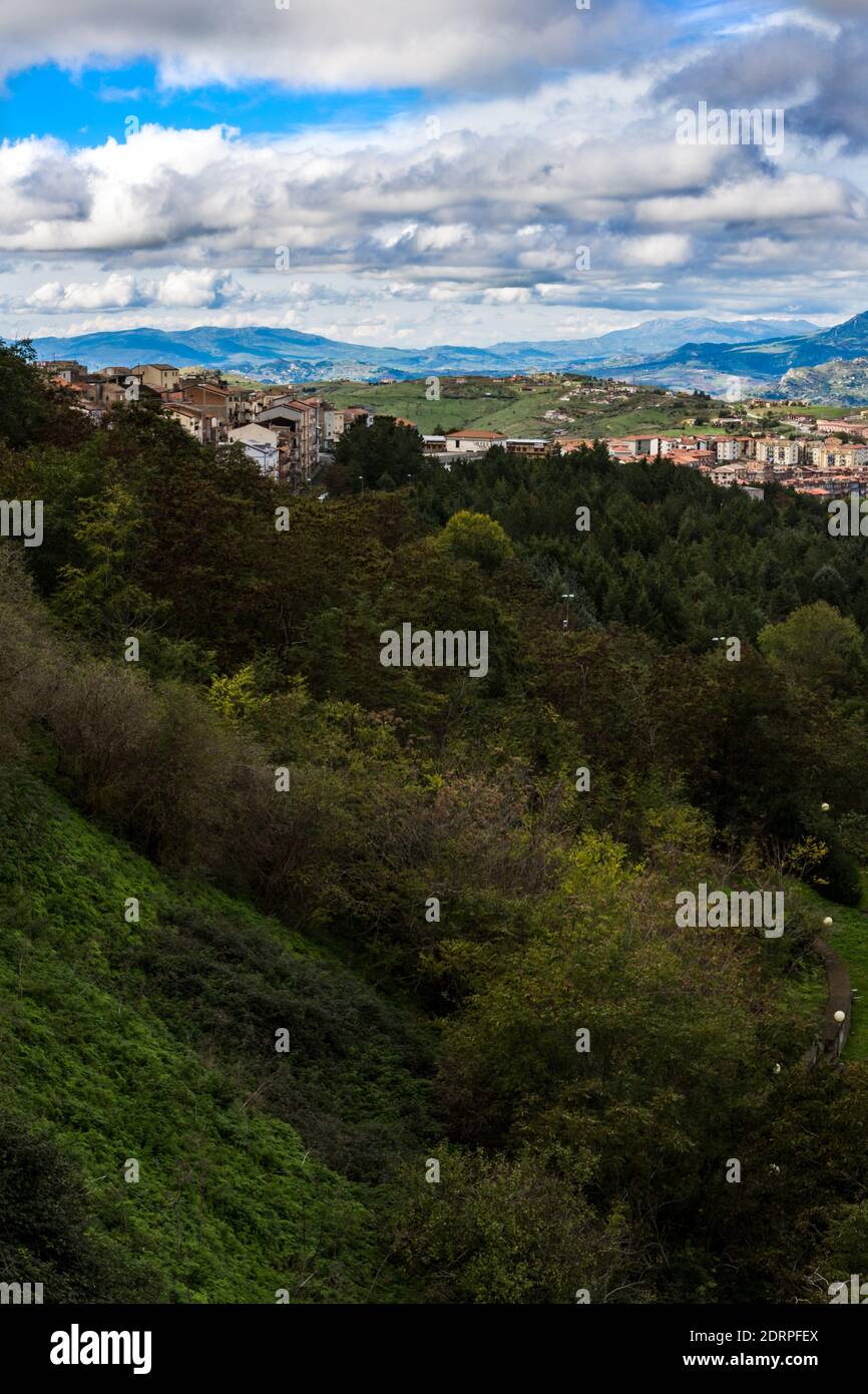 Hilly farmed and wooded countryside along a valley surrounded by ...