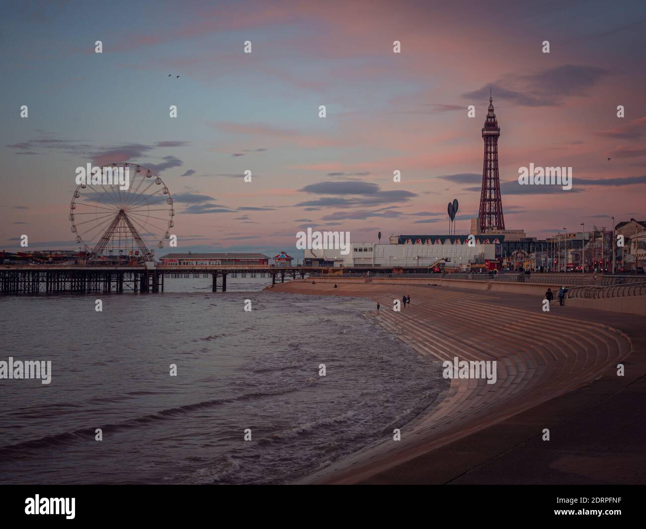 Blackpool Tower and the ferris wheel on the north pier on a colourful ...