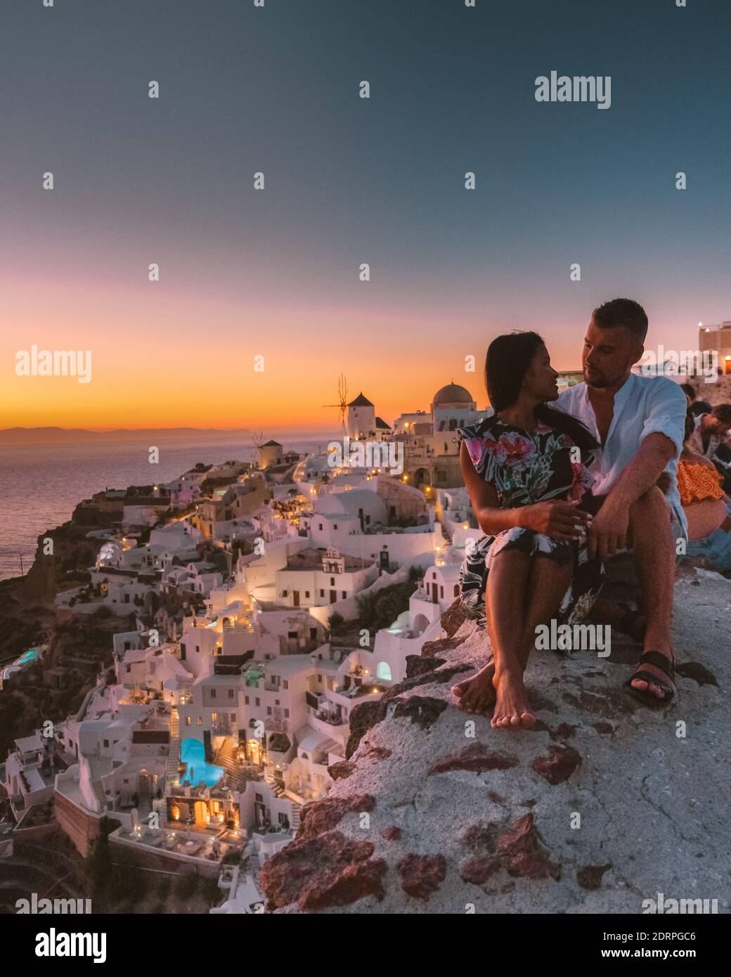 Santorini Island Greece, couple men and woman on vacation at the Greek ...