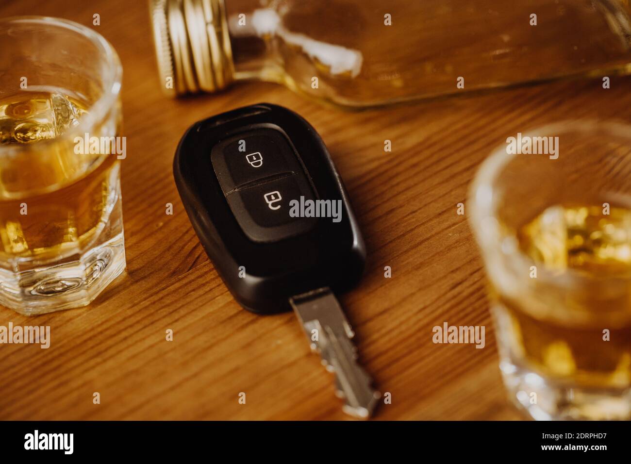 Close up of a car keys and very strong alcohol on the table, do not ...