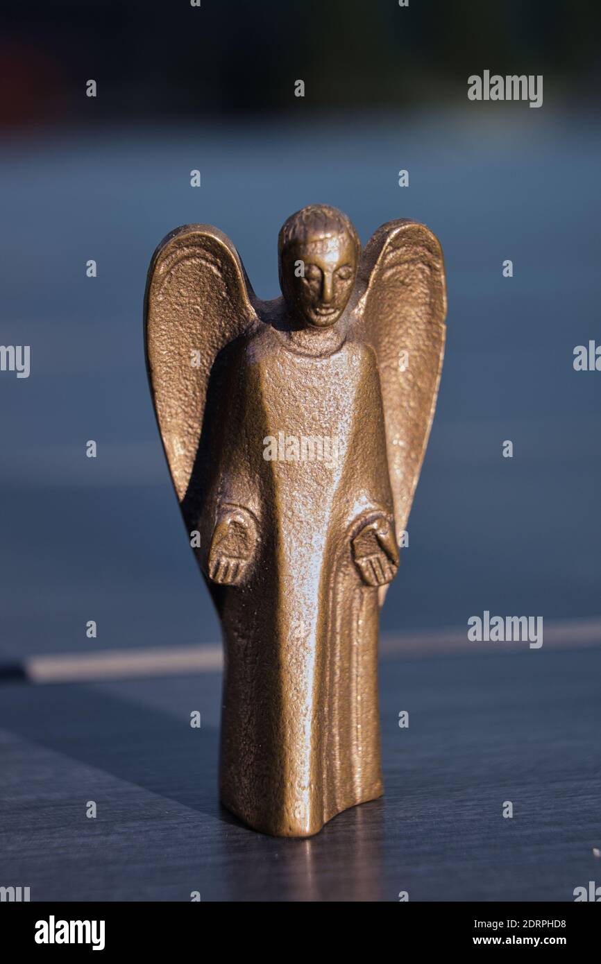 OLDENBURG, GERMANY - Dec 19, 2020: bronze sculpture of an angel on a ...