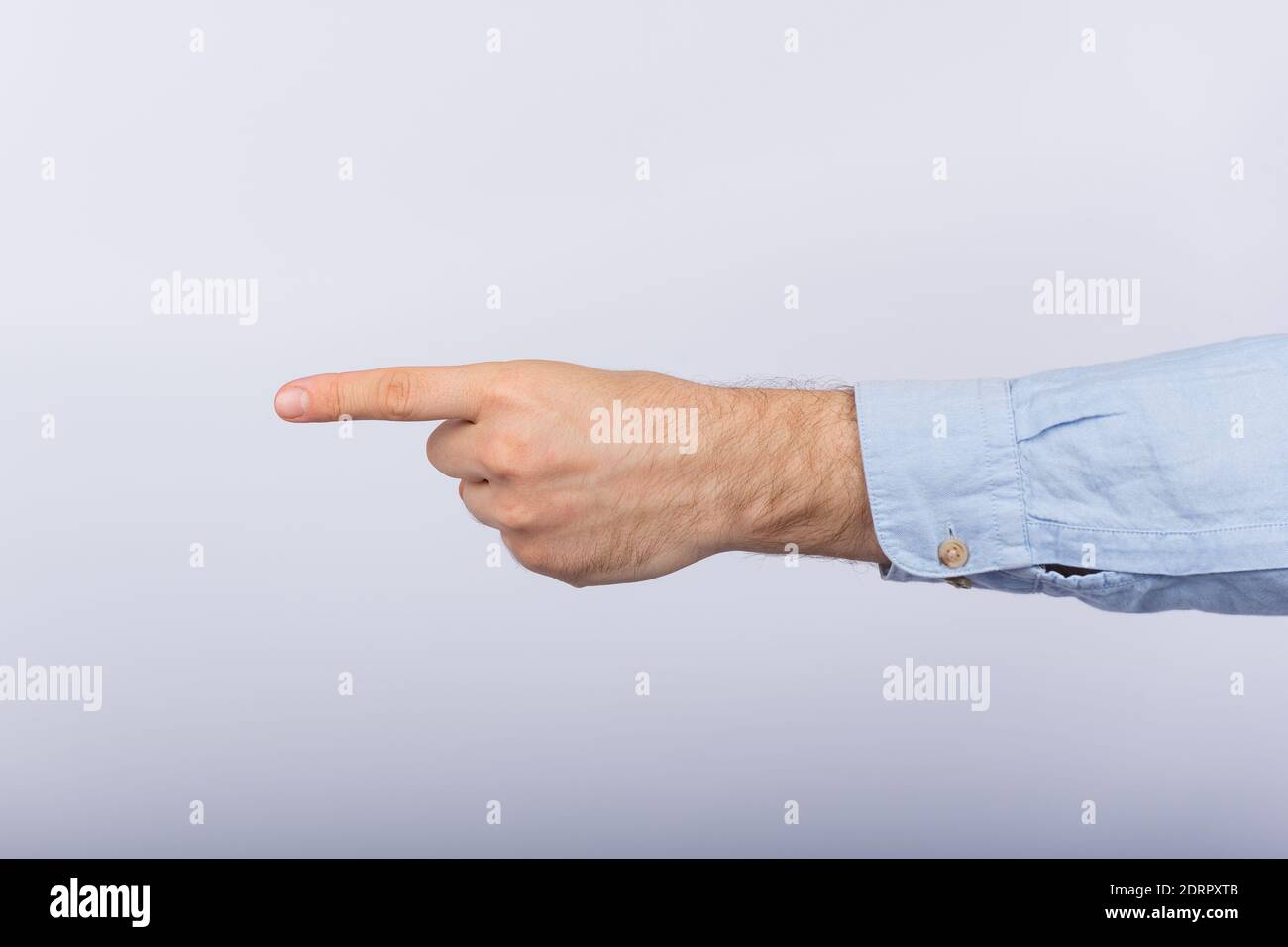 Male hand shows direction of index finger. Pointing hand on white ...