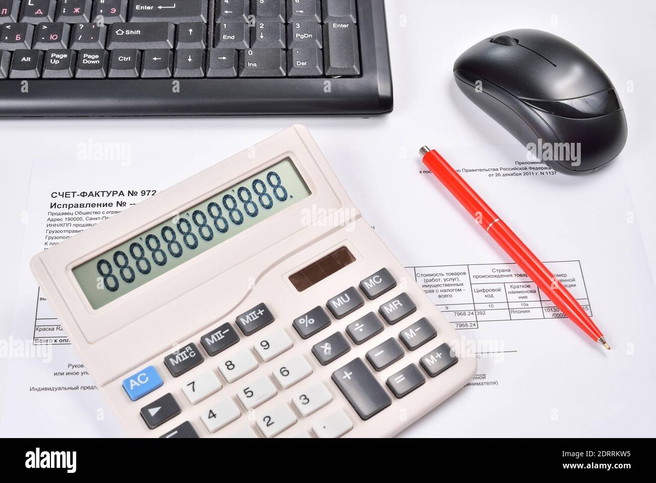 Desk accountant: invoice, keyboard, calculator, mouse, and red pen ...