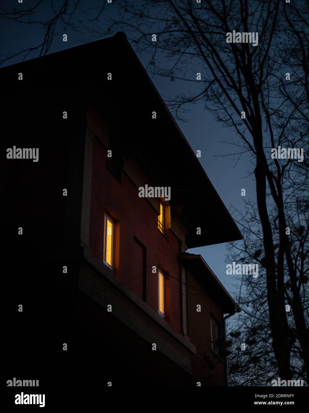 A vertical shot of a modern rural residential building with window ...