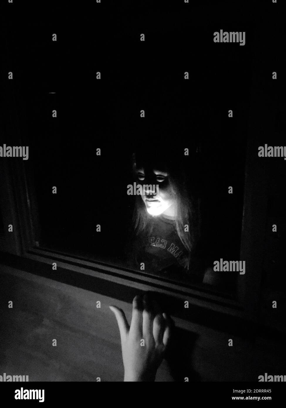 Girl in dark room High Resolution Stock Photography and Images - Alamy