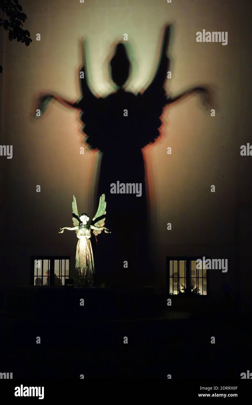 A vertical shot of the shadow of a statue on the wall Stock Photo - Alamy