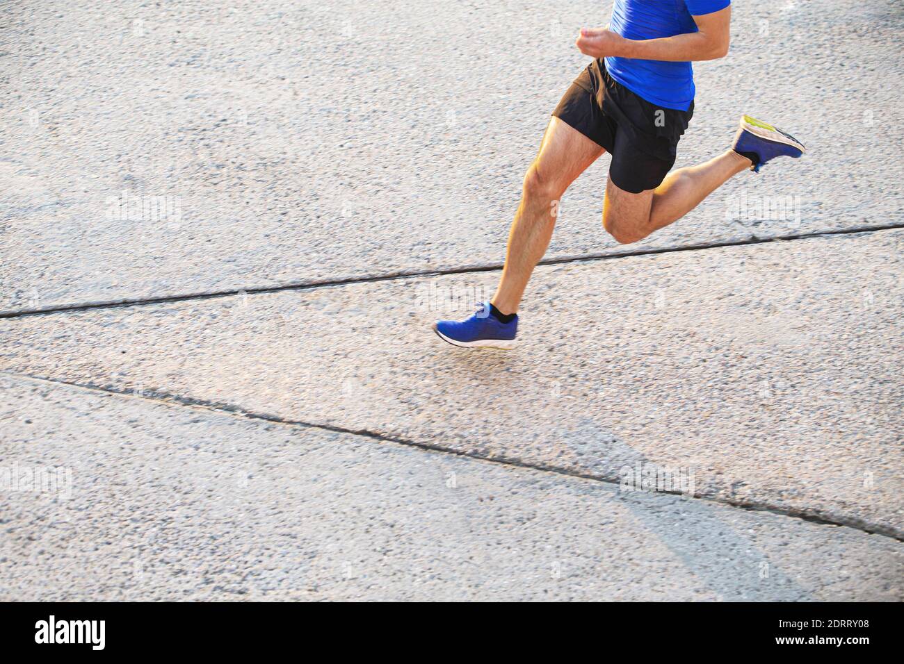 Man running on road hi-res stock photography and images - Alamy