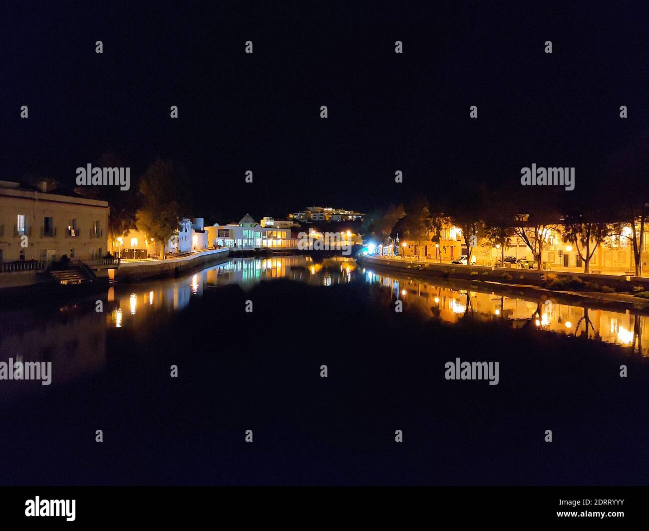 River in town with lights at night Stock Photo - Alamy