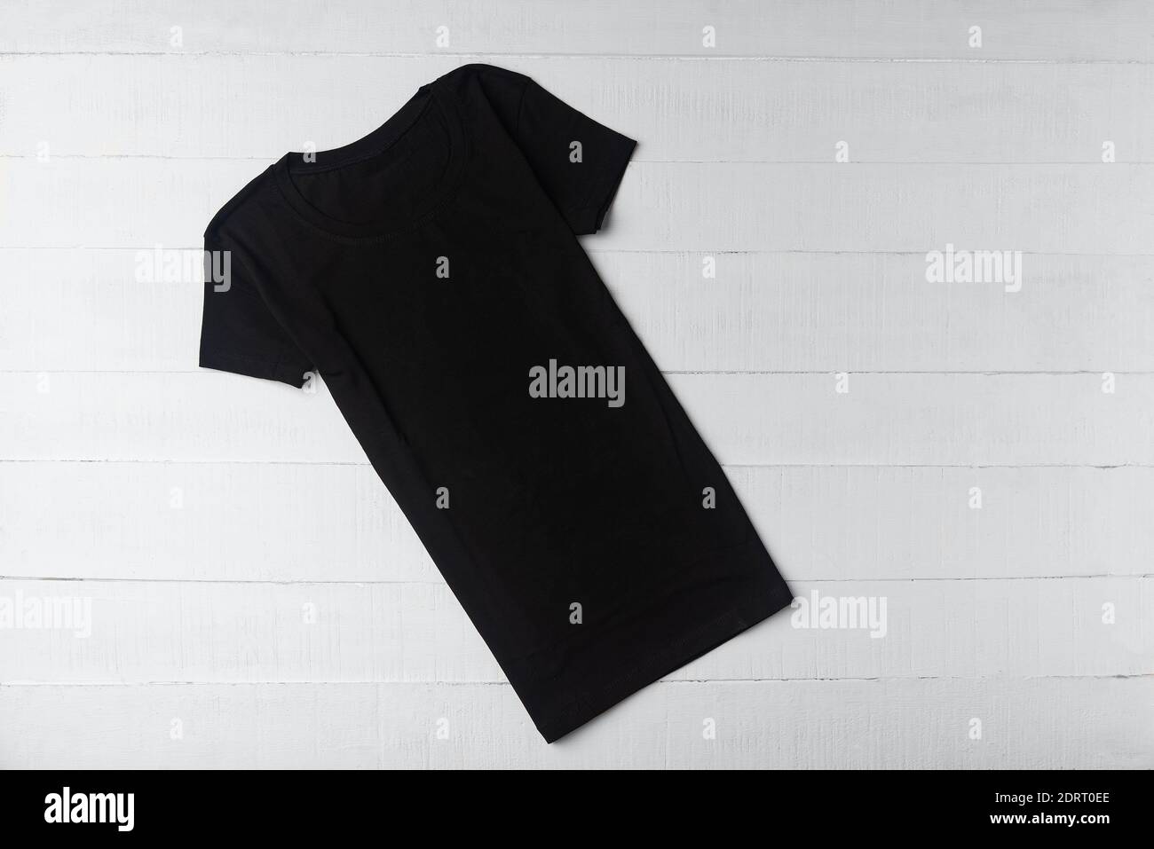 Black knitted t-shirt without pattern on white background. Clothing ...