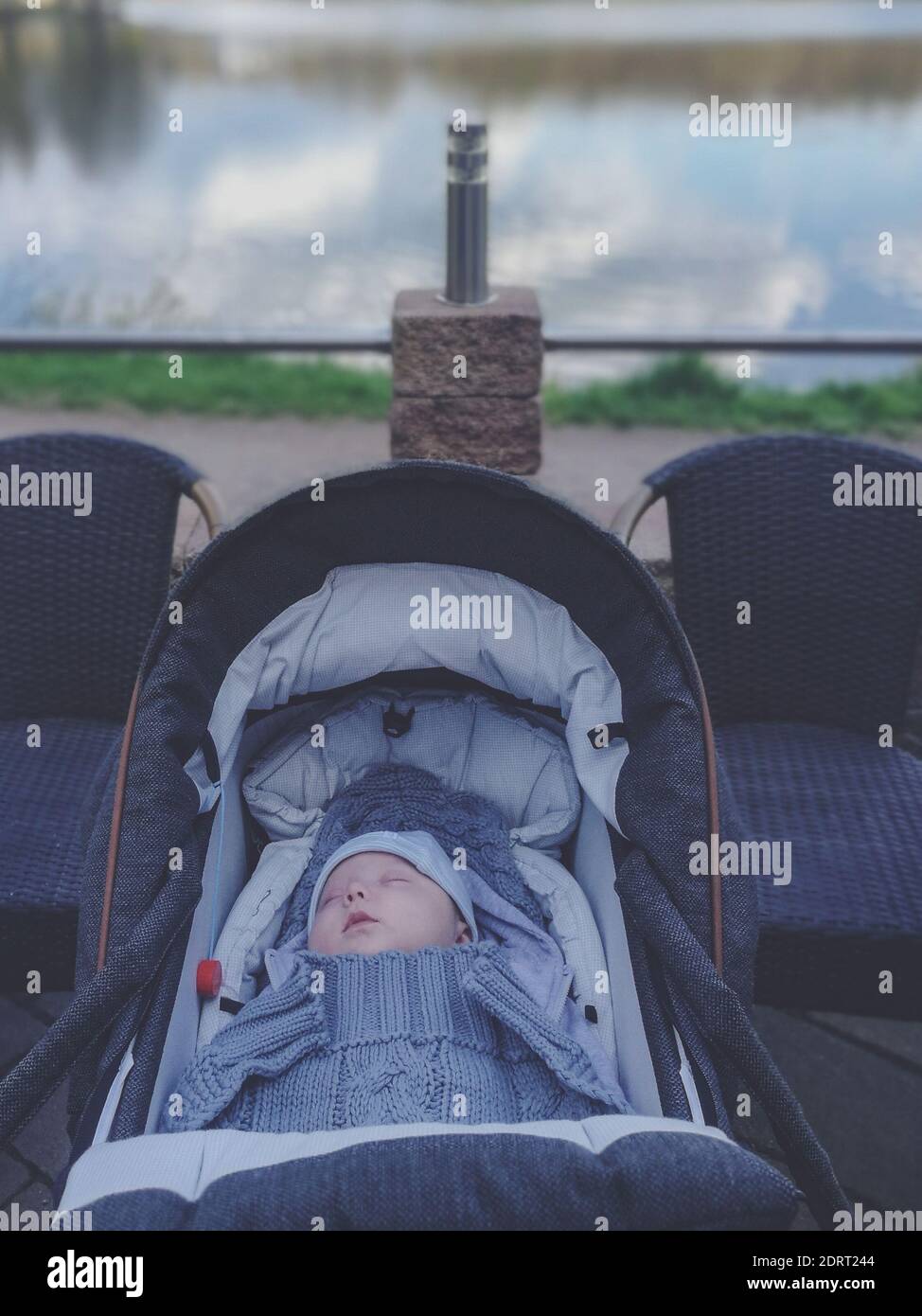 Baby Boy Sleeping In Stroller Stock Photo - Alamy