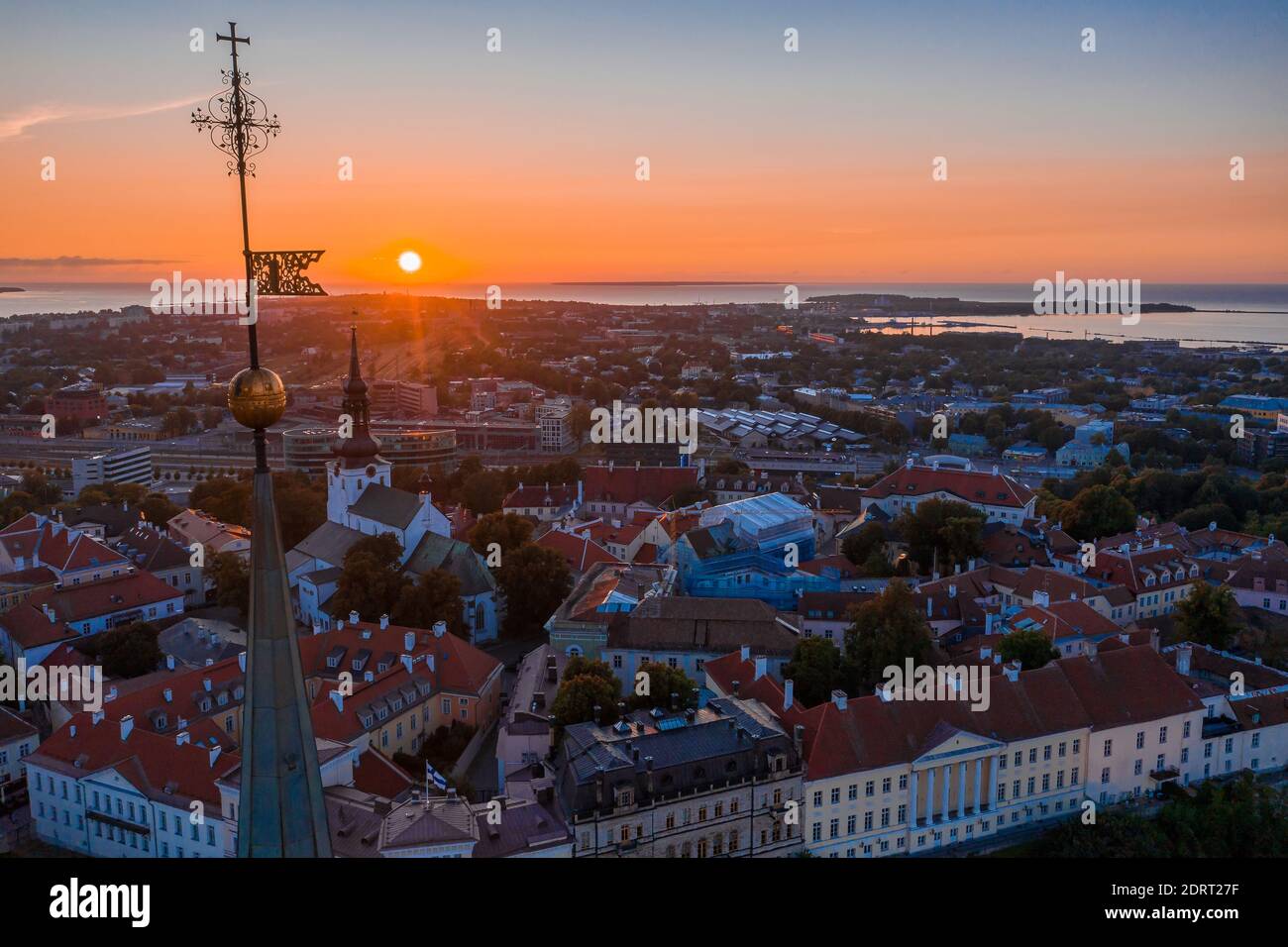 An aerial shot of a wonderful city with old buildings with red rooftops ...