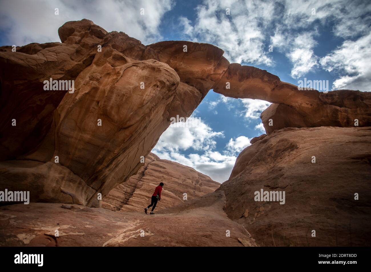 Umm Fruth Rock Bridge. Turist doing trekking in Wadi Rum Desert, Jordan ...