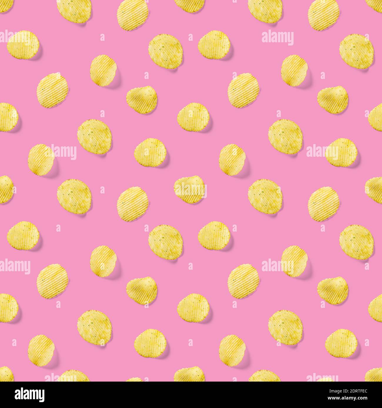 Seamless pattern made from Potato chips on pink background flat lay ...