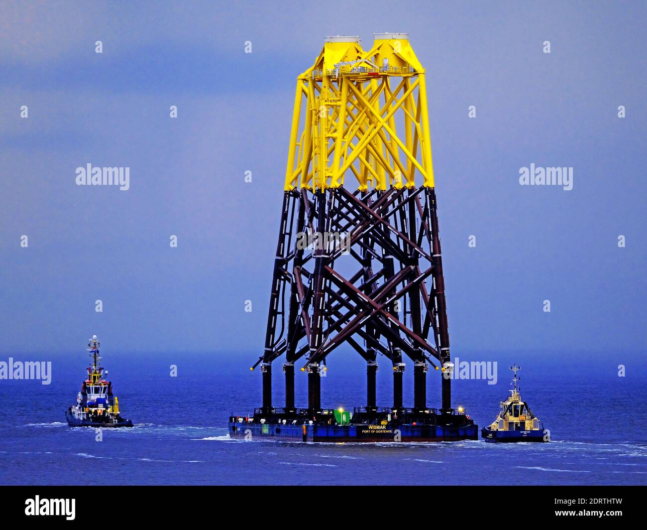 Wind turbine tops on barge Wismar with tug Multratug 18 passing ...
