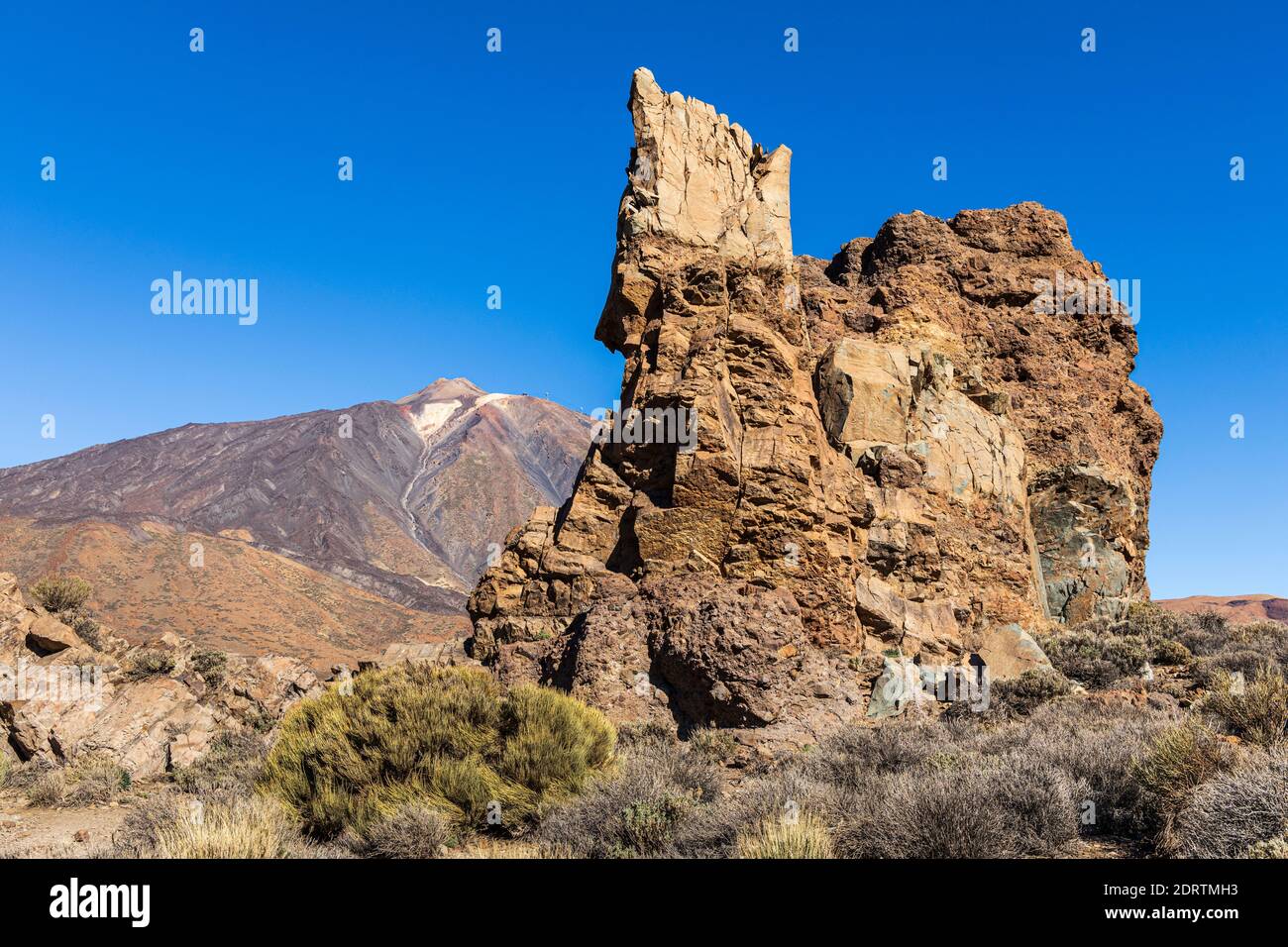 Volcanic rock formation and mount Teide volcano with blue sky in the ...