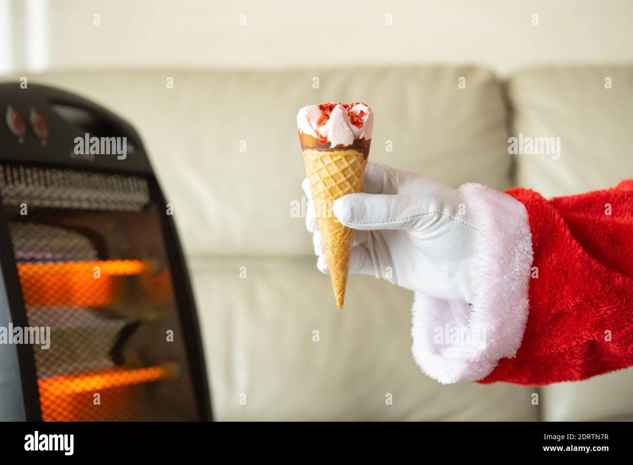 santa claus holding a strawberry flavor ice cream cone with an electric ...