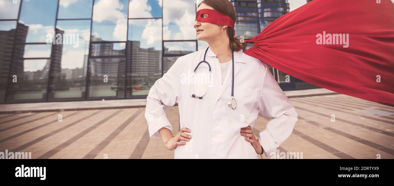 female paramedic in a hero raincoat standing on a city street Stock ...