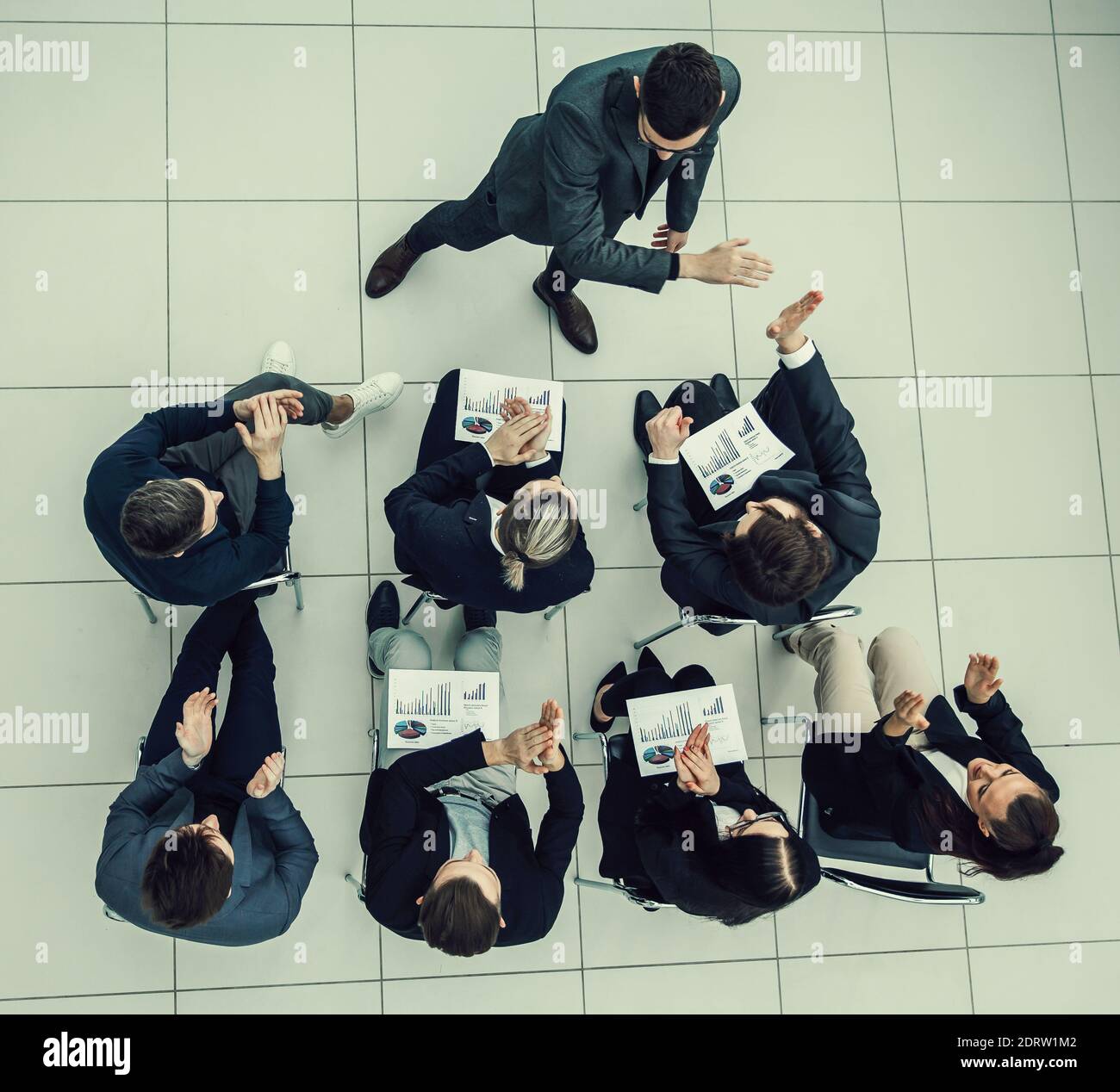 happy employees giving each other a high five at a work meeting Stock ...