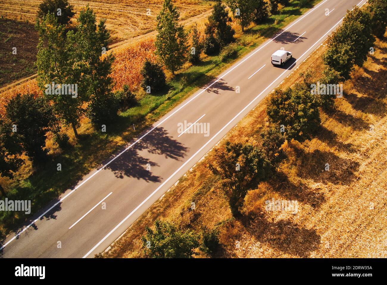 Aerial view of multipurpose vehicle on the road, driving through ...