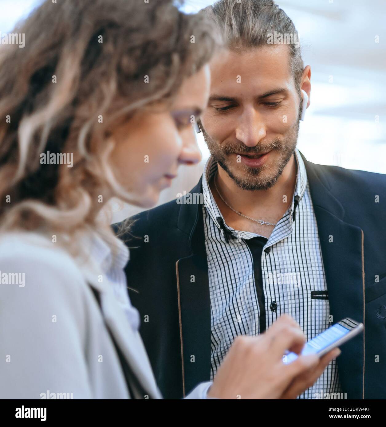 business colleagues discussing something in the subway Stock Photo - Alamy
