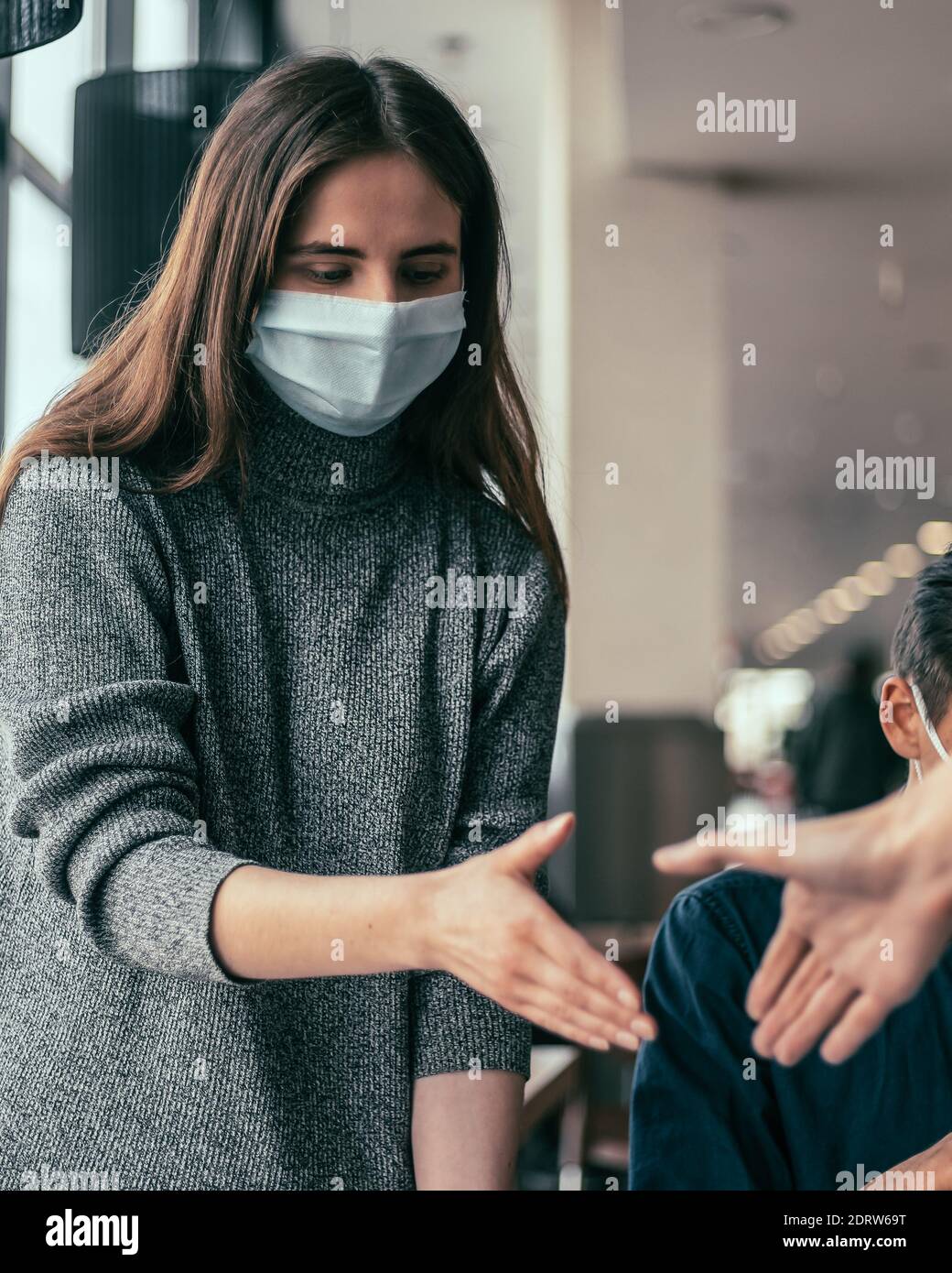 young employee holding out his hand for a handshake Stock Photo - Alamy