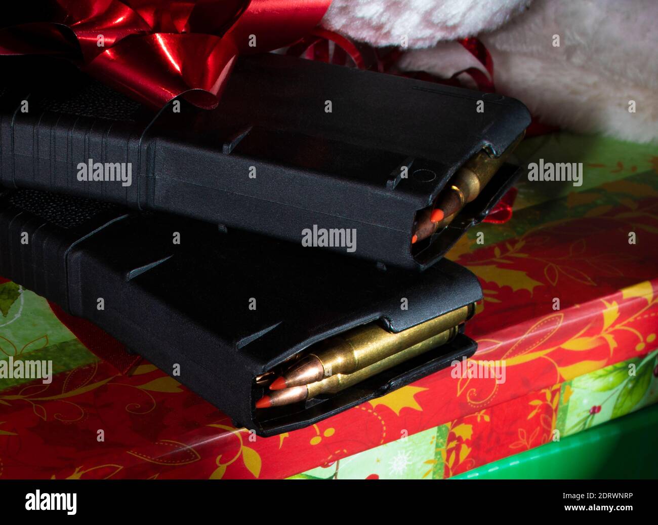 Black polymer AR-15 magazines loaded with cartridges with Christmas box ...