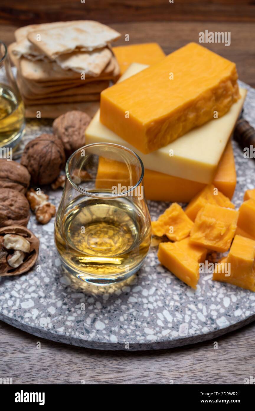 Cheese collection, orange and yellow smoked British cheese from England ...