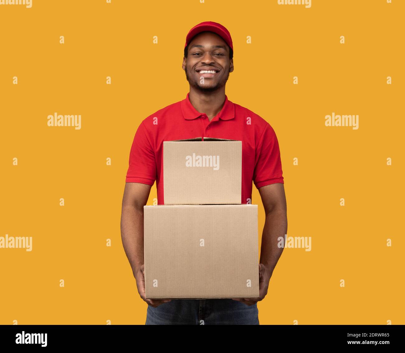 African american delivery man carrying hi-res stock photography and ...