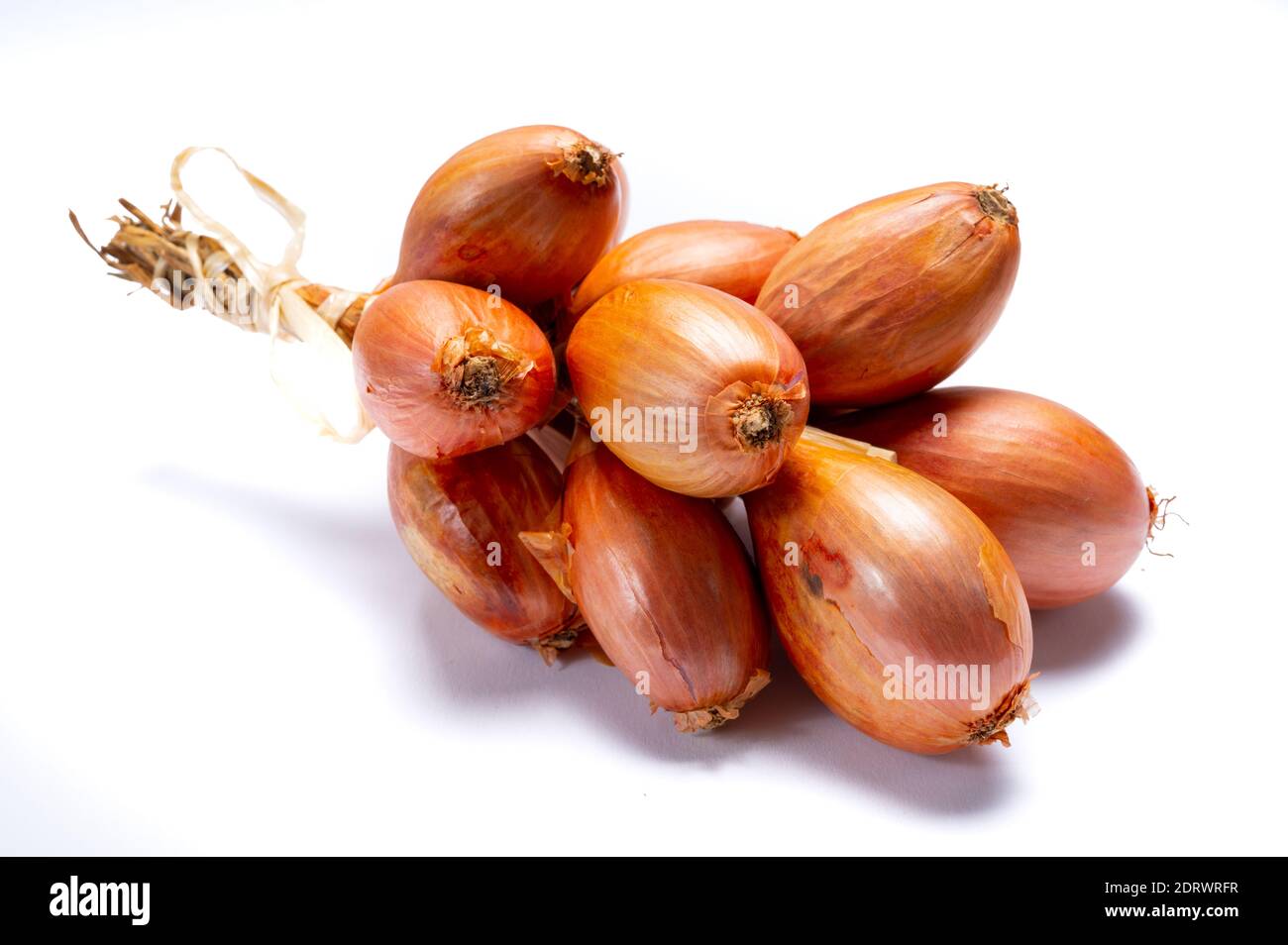 Bunch of French shallots grappe onion from Brittany, France on white ...